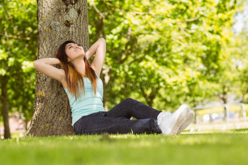 1,931 Young Woman Sitting Against Tree Stock Photos - Free & Royalty ...
