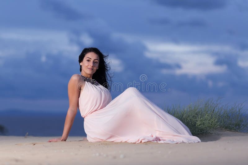 Beautiful Woman Sitting Alone on a Sand Dune Stock Image - Image of ...