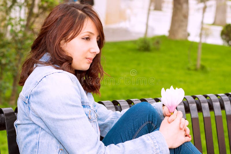 Beautiful Woman Sitting on a Bench Stock Image - Image of bright, bench ...