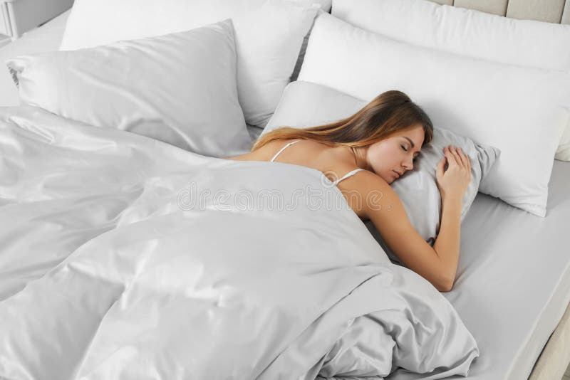 Beautiful Woman Sleeping in Bed with Silky Linens Stock Image - Image ...
