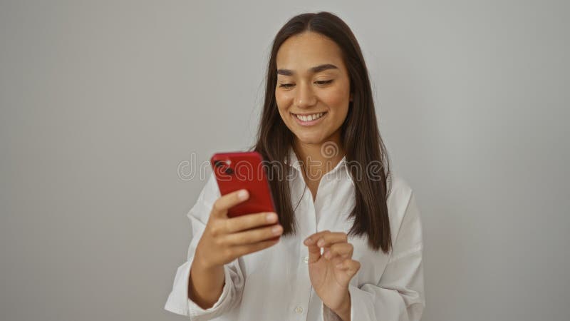 Beautiful Woman Smiling while Using a Red Phone in an Indoor Home ...