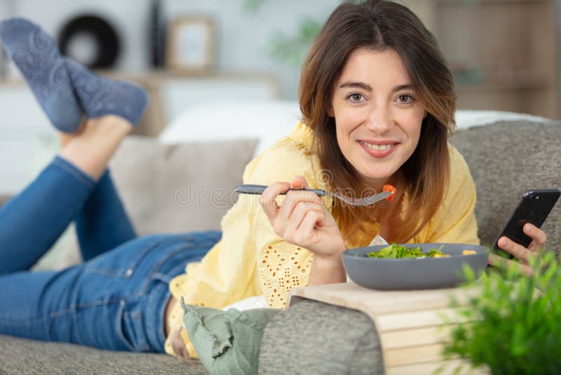 Beautiful Woman on Sofa Eating Healthy Salade Stock Photo - Image of ...