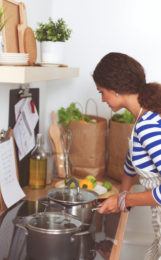 Beautiful Woman Standing in Kitchen with Apron Stock Image - Image of ...