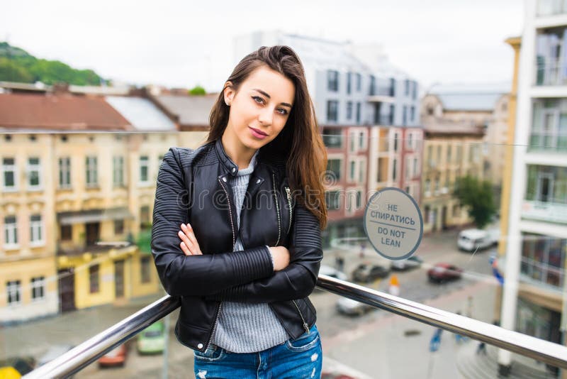 Beautiful Woman Standing on the Terrace of a Building. Stock Image ...