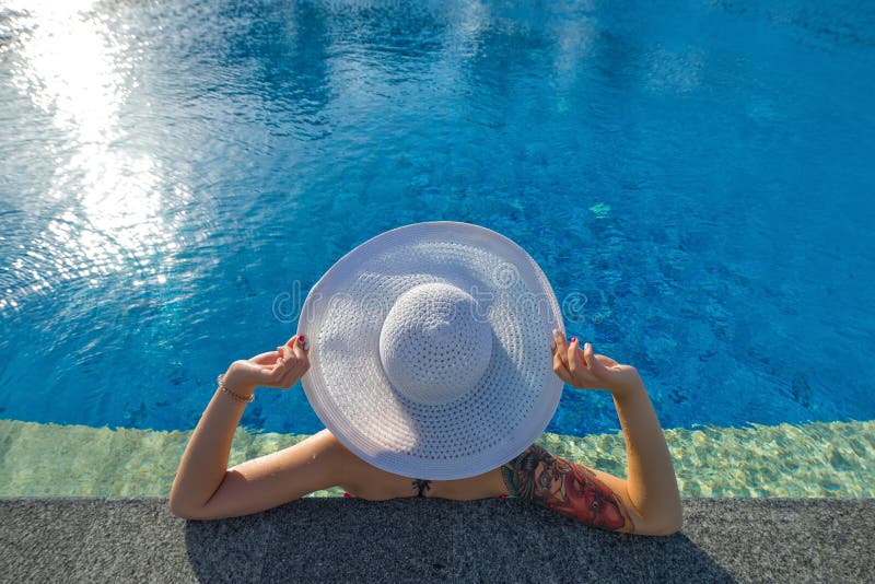 Beautiful Woman Sunbathing by the Pool Top View Horizontal. Summer ...