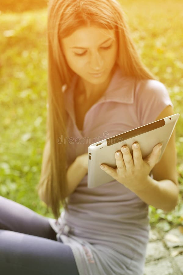 Beautiful Woman with Tablet Computer in Park Stock Image - Image of ...