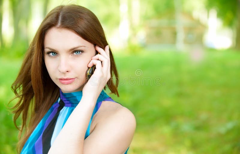 Beautiful Woman Talks by Mobile Stock Photo - Image of girl, park: 18356230