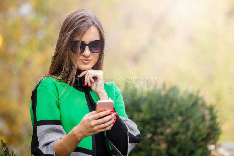 Beautiful Woman Texting on Her Smartphone Stock Image - Image of green ...