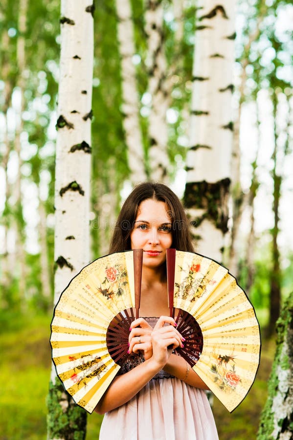 Beautiful Woman with Two Fans Stock Image - Image of brunette, closed ...