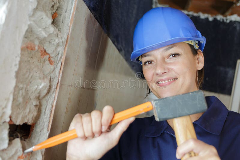 Beautiful Woman Using Hammer on Wall Stock Photo - Image of closeup ...