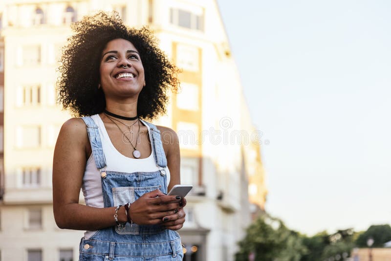 Beautiful Woman Using Mobile in the Street. Stock Image - Image of ...