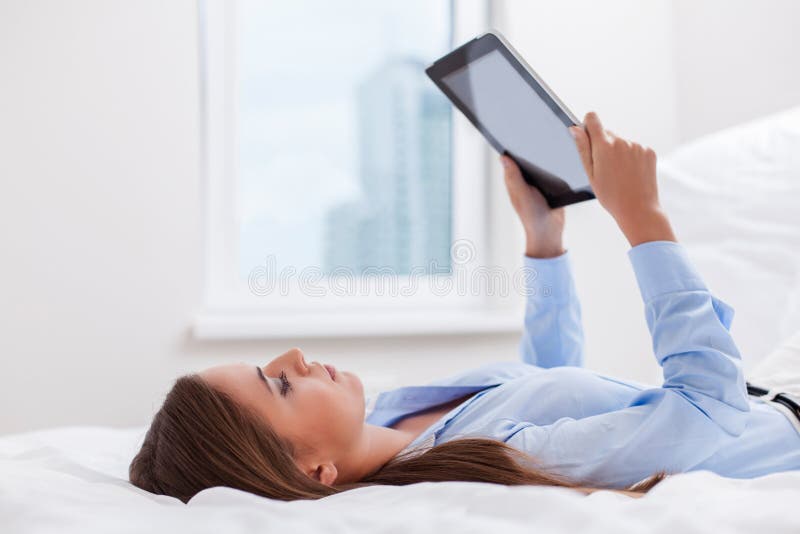 Beautiful Woman Using Tablet Computer on Her Bed Stock Photo - Image of ... Beautiful Woman Using Tablet Computer on Her Bed Stock Photo - Image of ...