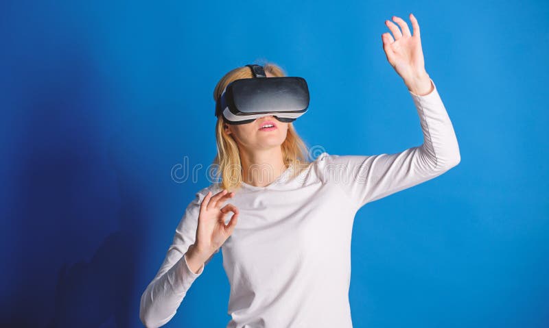 Beautiful Woman Wearing Virtual Reality Goggles in Studio. Woman Using ...