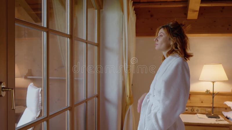 Beautiful Woman in White Robe Side View Thinking while Standing by the ...