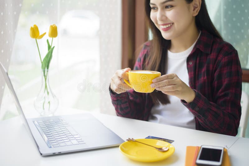 Beautiful Woman is Working with Laptop Computer in Coffee Shop Stock ...