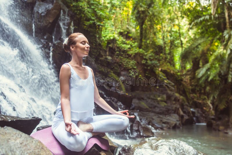 Yoga on the waterfall stock photo. Image of gymnastics - 101944208
