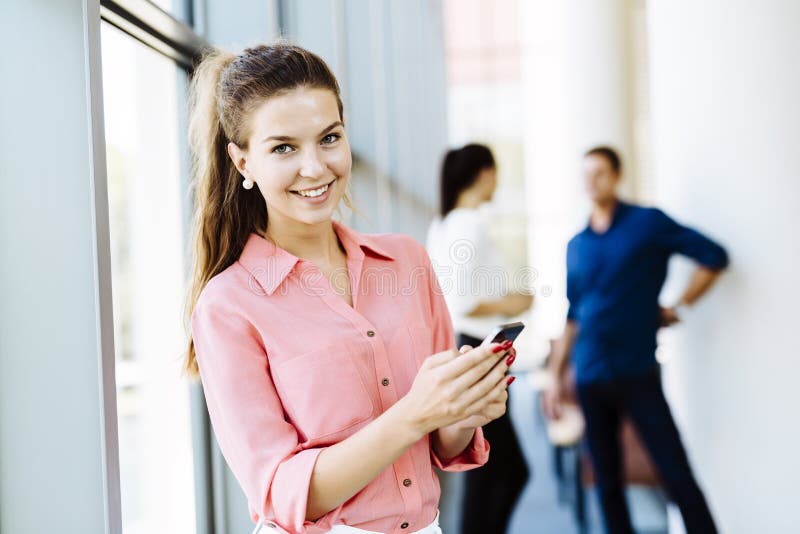 Beautiful Women Using Phones and Talkin during Break Stock Photo ...