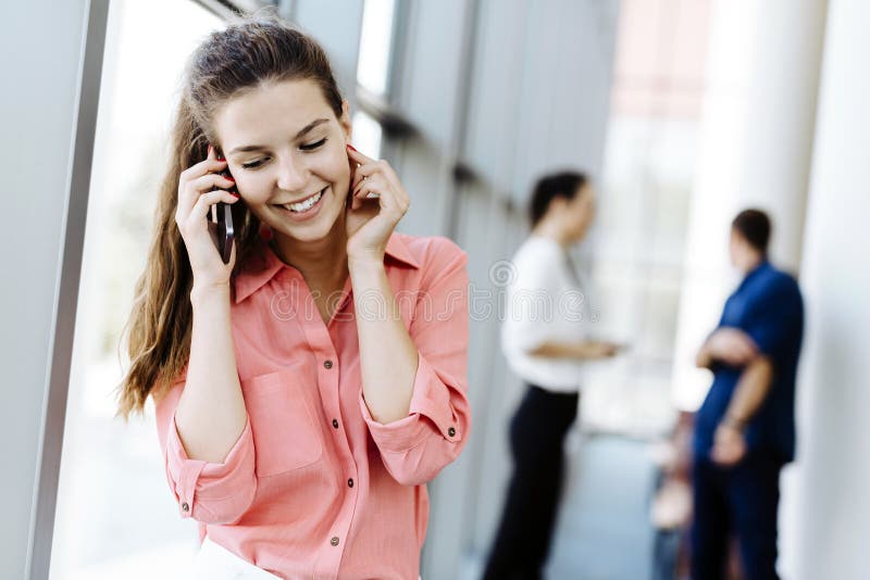 Beautiful Women Using Phones and Talkin during Break Stock Image ...