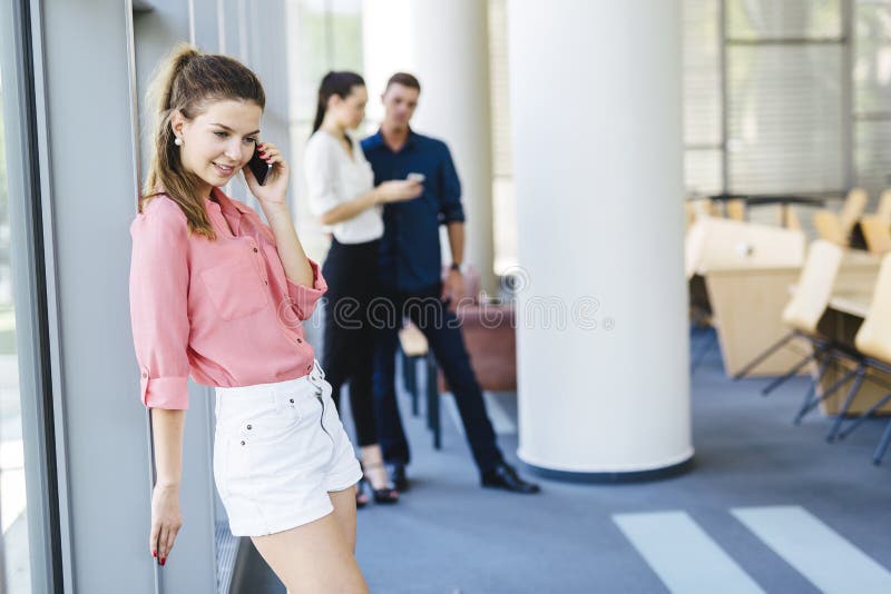 Beautiful Women Using Phones and Talkin during Break Stock Photo ...