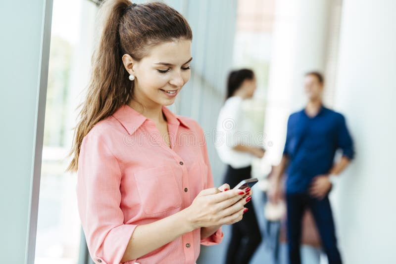 Beautiful Women Using Phones and Talkin during Break Stock Image ...
