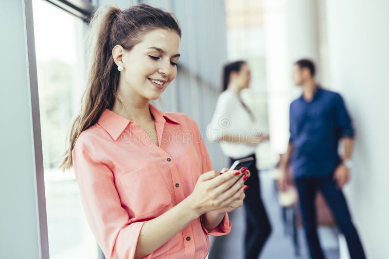 Beautiful Women Using Phones and Talkin during Break Stock Image ...