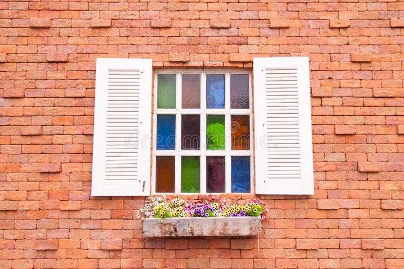 Beautiful Wood Window with Multi Color Glass and Brick Wall Stock Image ...