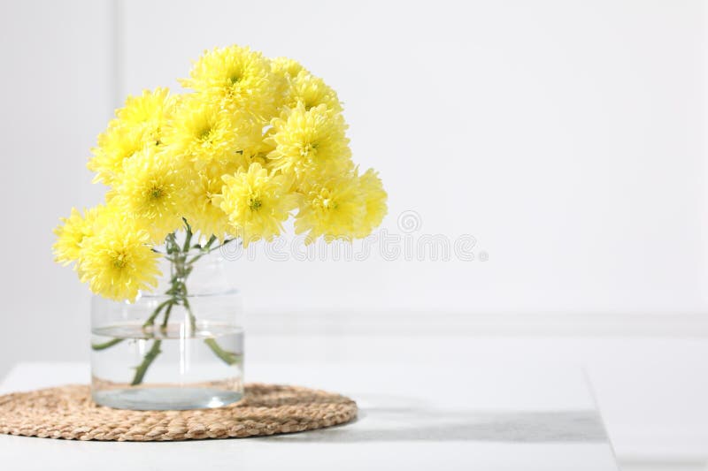 Beautiful Yellow Flowers in Vase on Table Indoors. Space for Text Stock ...