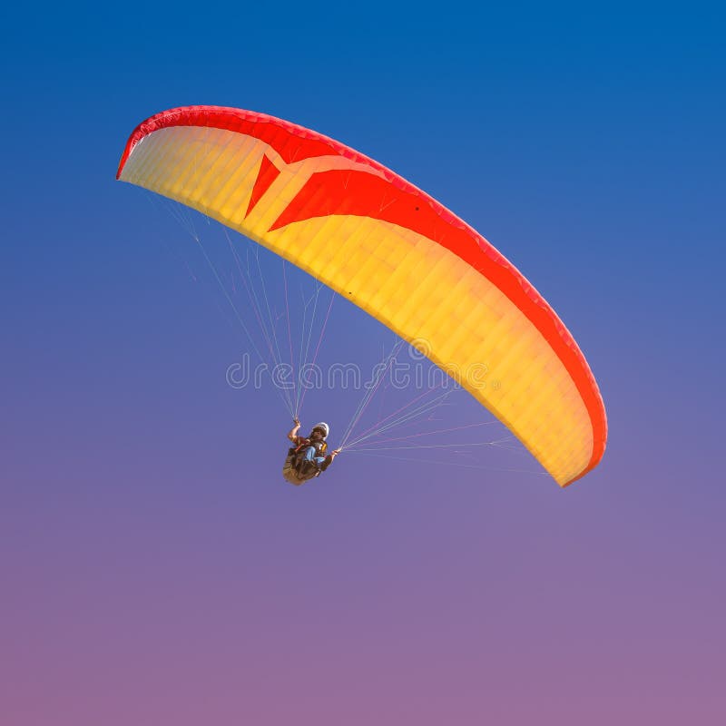 Beautiful Yellow and Red Paraglider Flying in Colorful Sky Editorial ...