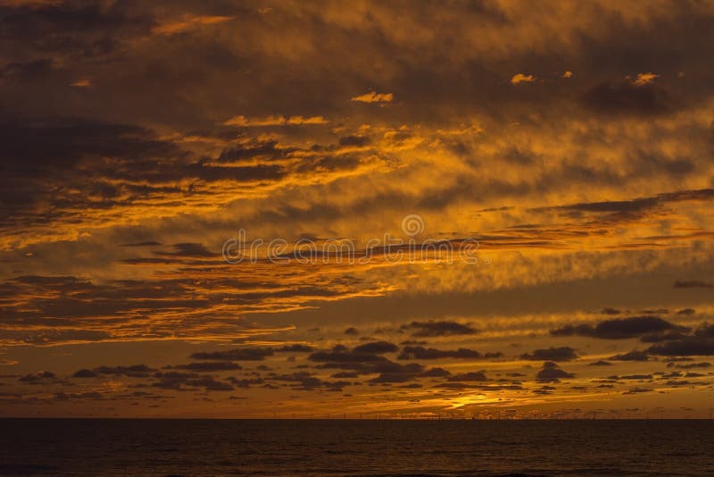 Beautiful Yellow Sundown Over the Sea with Many Clouds Stock Image ...