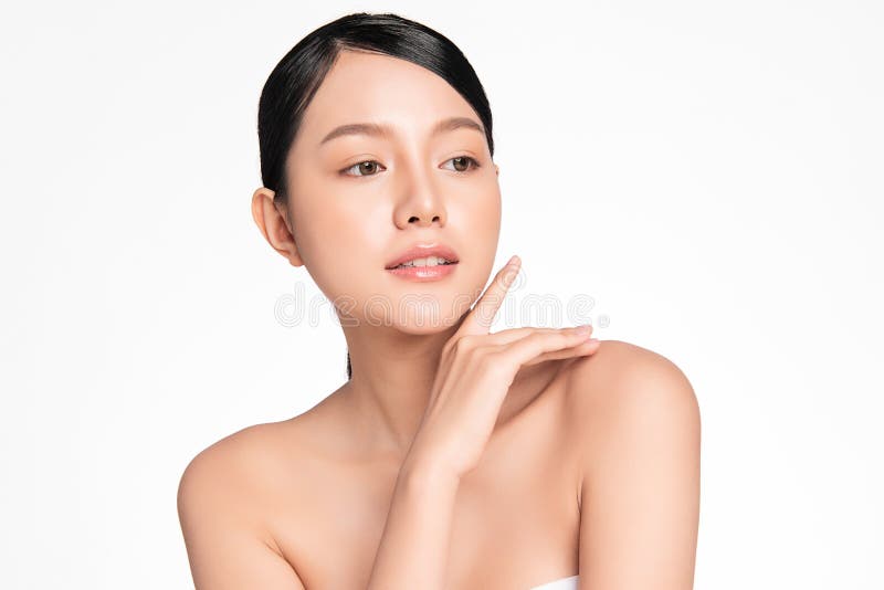 Beautiful Young Asian Woman With Clean Fresh Skin On White Background