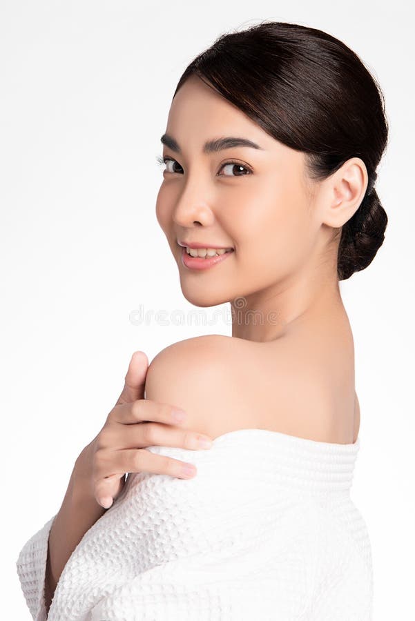Beautiful Young Asian Woman With Clean Fresh Skin On White Background