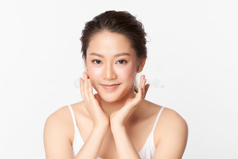 Beautiful Young Asian Woman With Clean Fresh Skin On White Background