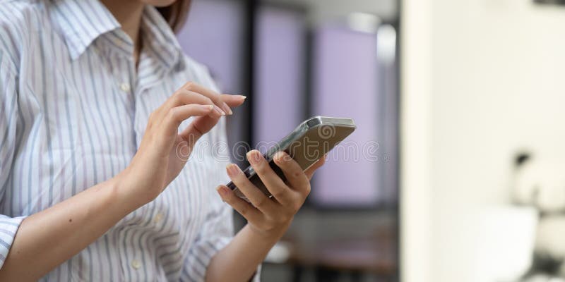 A Beautiful Young Asian Woman Holding and Using Mobile Phone. Stock ...