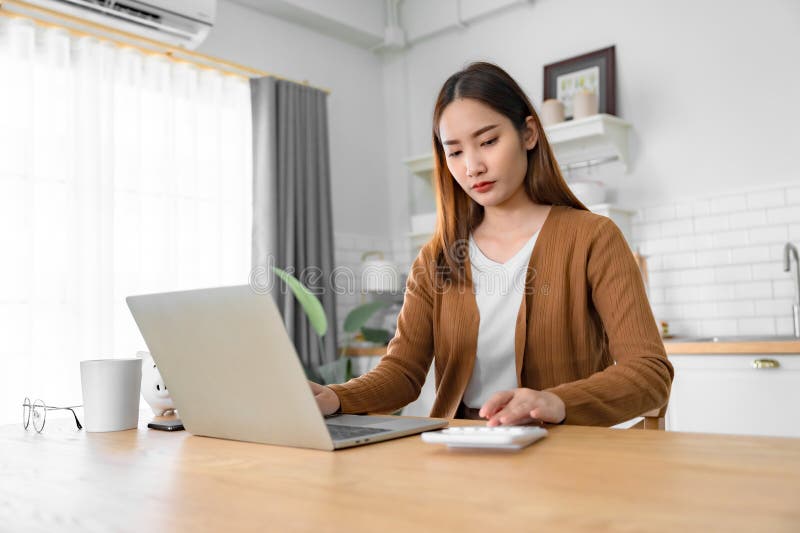 Beautiful Young Asian Woman Working with Laptop Computer in Home ...