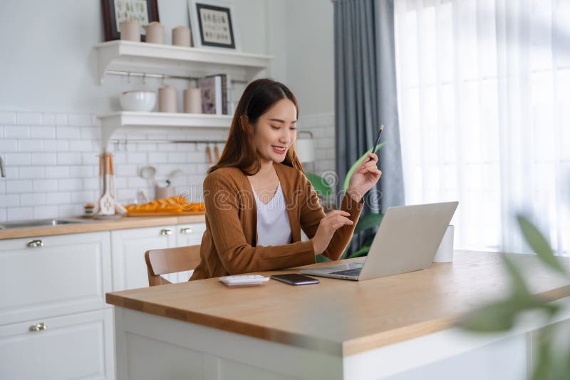 Beautiful Young Asian Woman Working with Laptop Computer in Home ...
