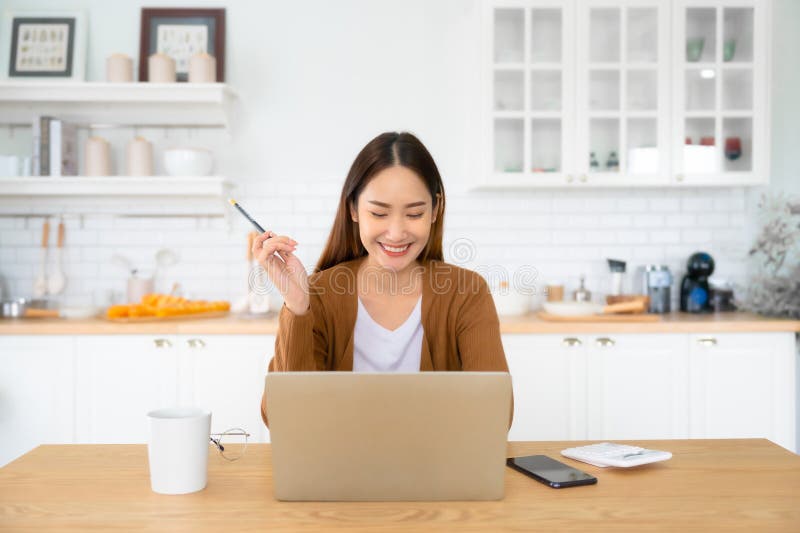 Beautiful Young Asian Woman Working with Laptop Computer in Home ...