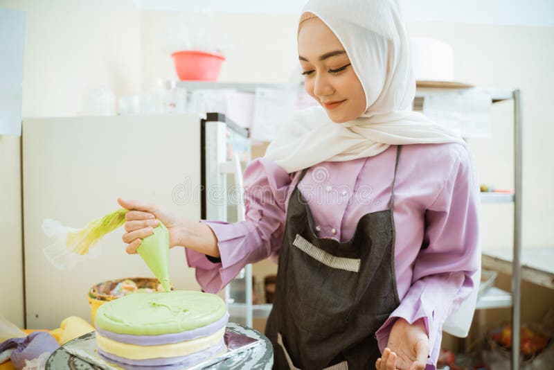 Beautiful Young Baker Making Cake at Her Kitchen Stock Photo - Image of ...