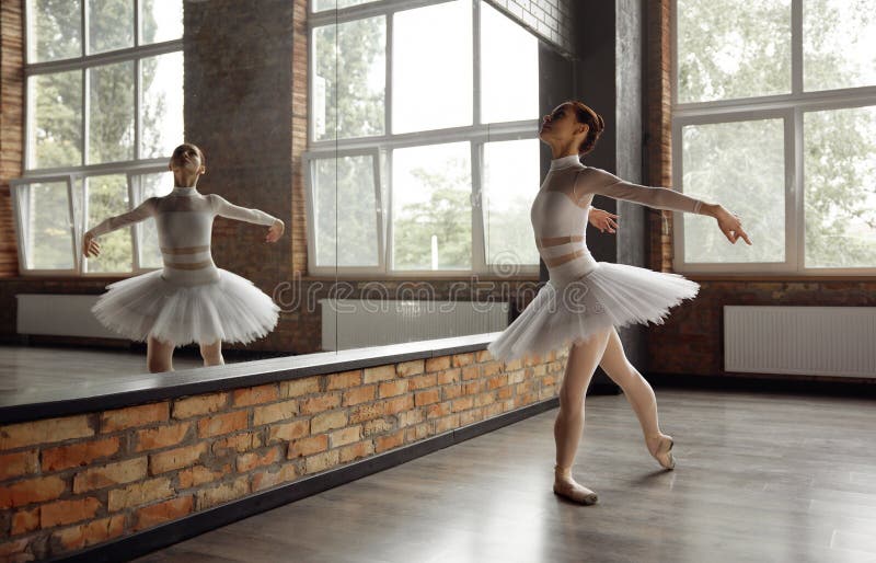Beautiful Young Ballerina Training Classic Ballet in Studio with Huge ...