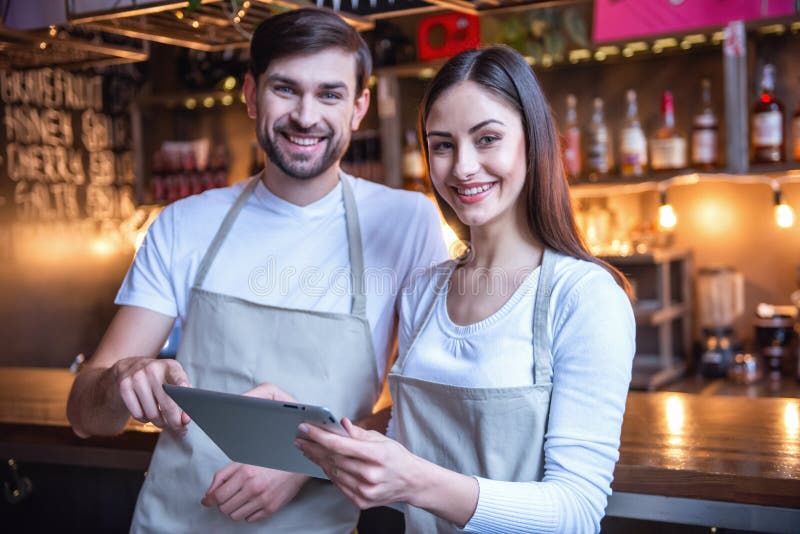 Two Young Baristas Working in Coffee Shop, Standing by Counter ...