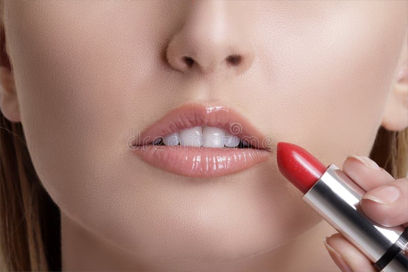 Beautiful Young Blond Model Applying Lipstick Stock Photo - Image of ...