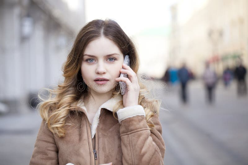 Beautiful Young Blonde Calling by Phone Stock Photo - Image of autumn ...