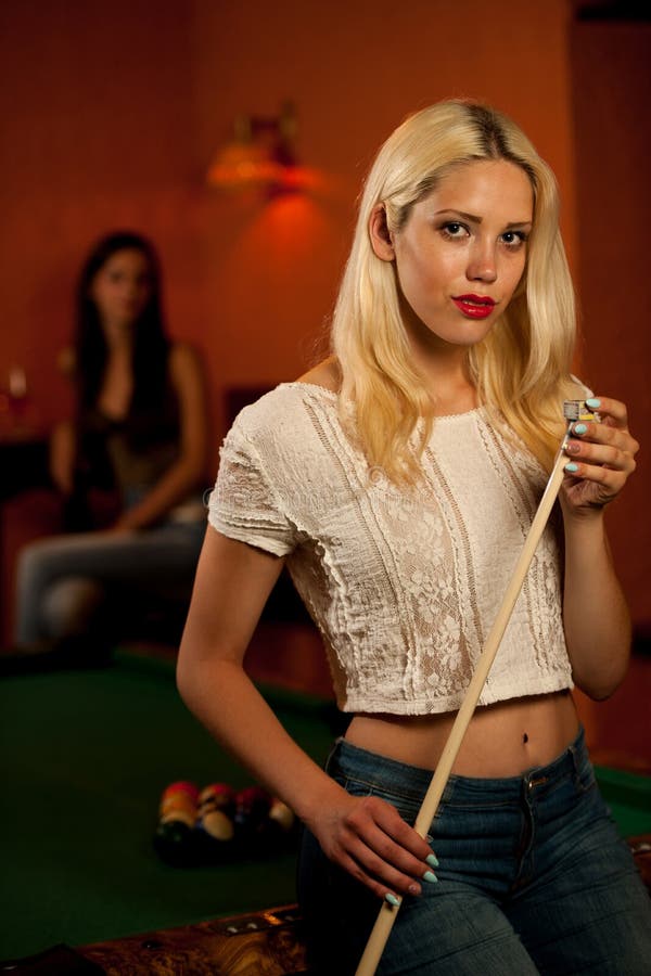 Beautiful Young Blonde Woman Playing Billiard In A Bar Stock Image