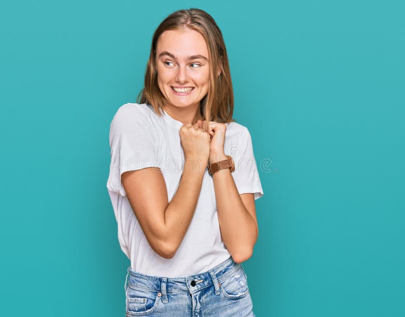 Beautiful Young Blonde Woman Wearing Casual White T Shirt Laughing