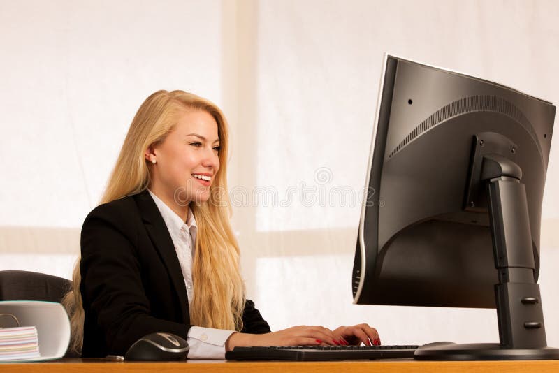 Beautiful Young Blonde Woman Working on Computer in Her Office Stock ...
