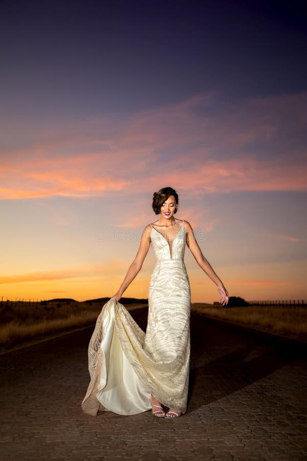 Beautiful Young Bride Outdoors at Sunset Stock Image - Image of shoes ...
