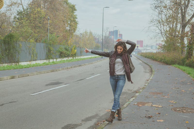 Beautiful Young Brunette Hitching a Ride Stock Image - Image of model ...