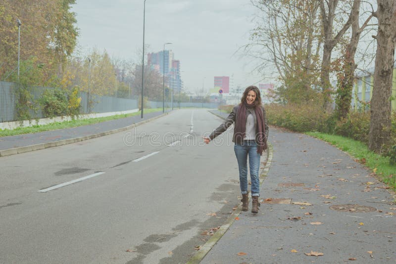 Beautiful Young Brunette Hitching a Ride Stock Image - Image of girl ...