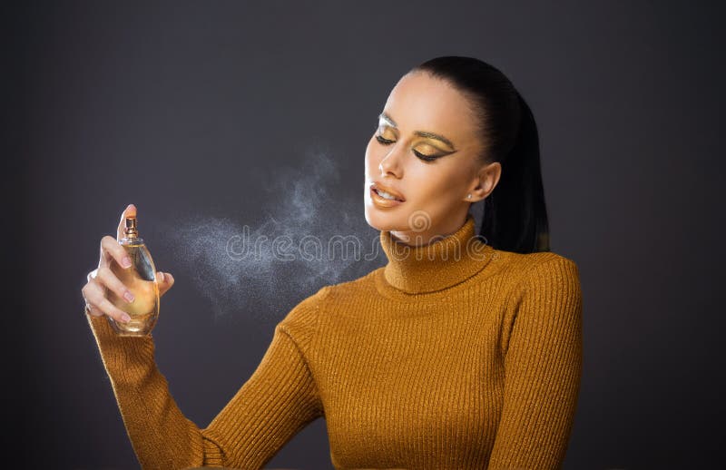 Beautiful Young Brunette Model Using Perfume Stock Image - Image of ...