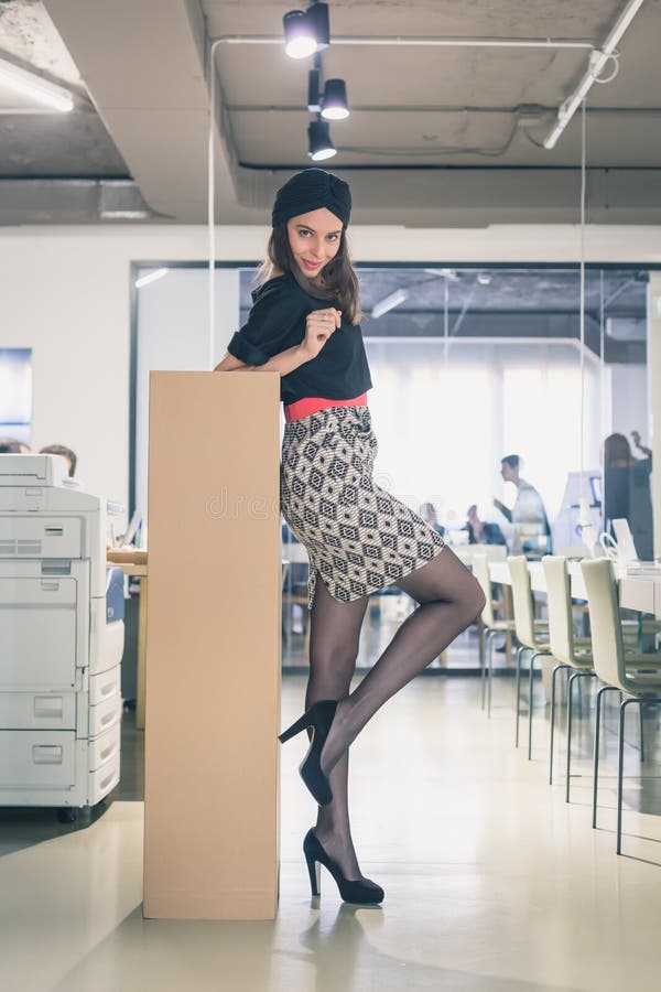 Beautiful Young Brunette Posing in an Office Stock Photo - Image of ...