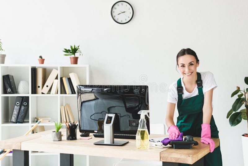Beautiful Young Cleaner Smiling at Camera while Cleaning Table Stock ...